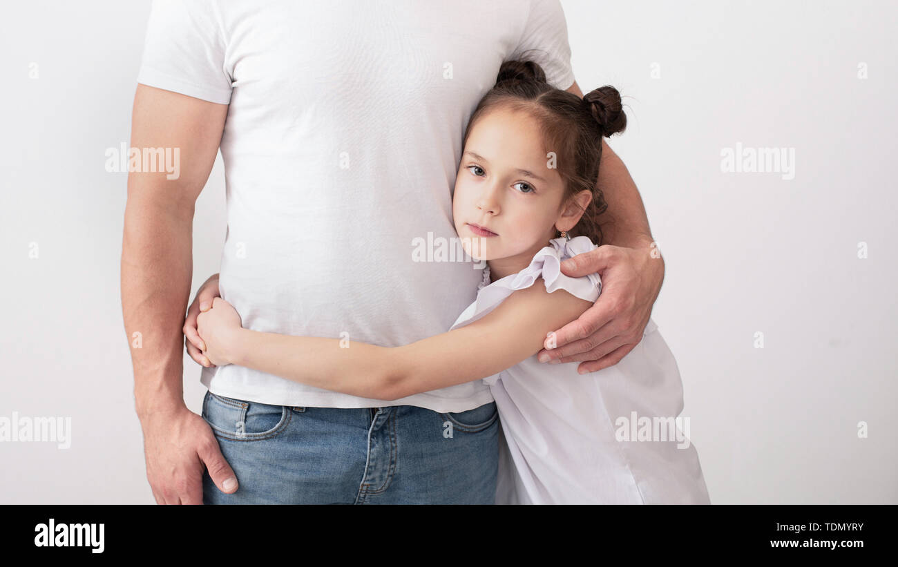 Sad daughter hugging her father, difficulties between parents and ...