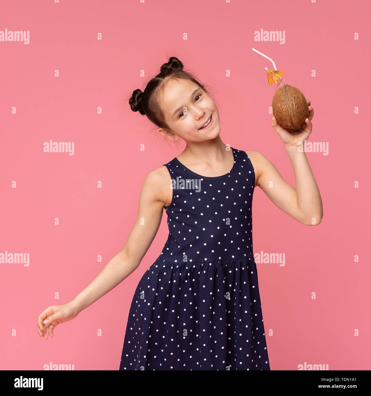 Cute little girl enjoying fresh coconut cocktail Stock Photo - Alamy
