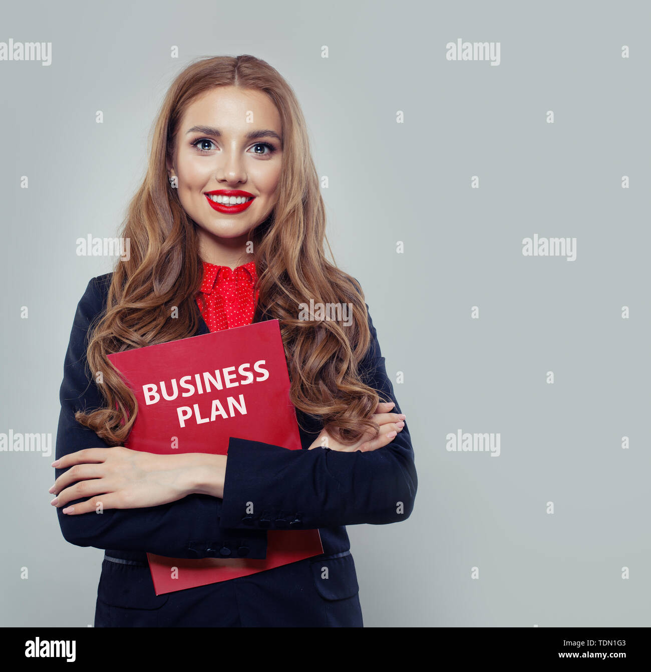 Smart business woman holding business plan Stock Photo - Alamy