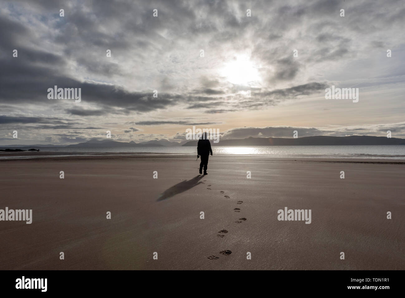 Walk on the beach in the late evening sunshine exploring the scenic ...