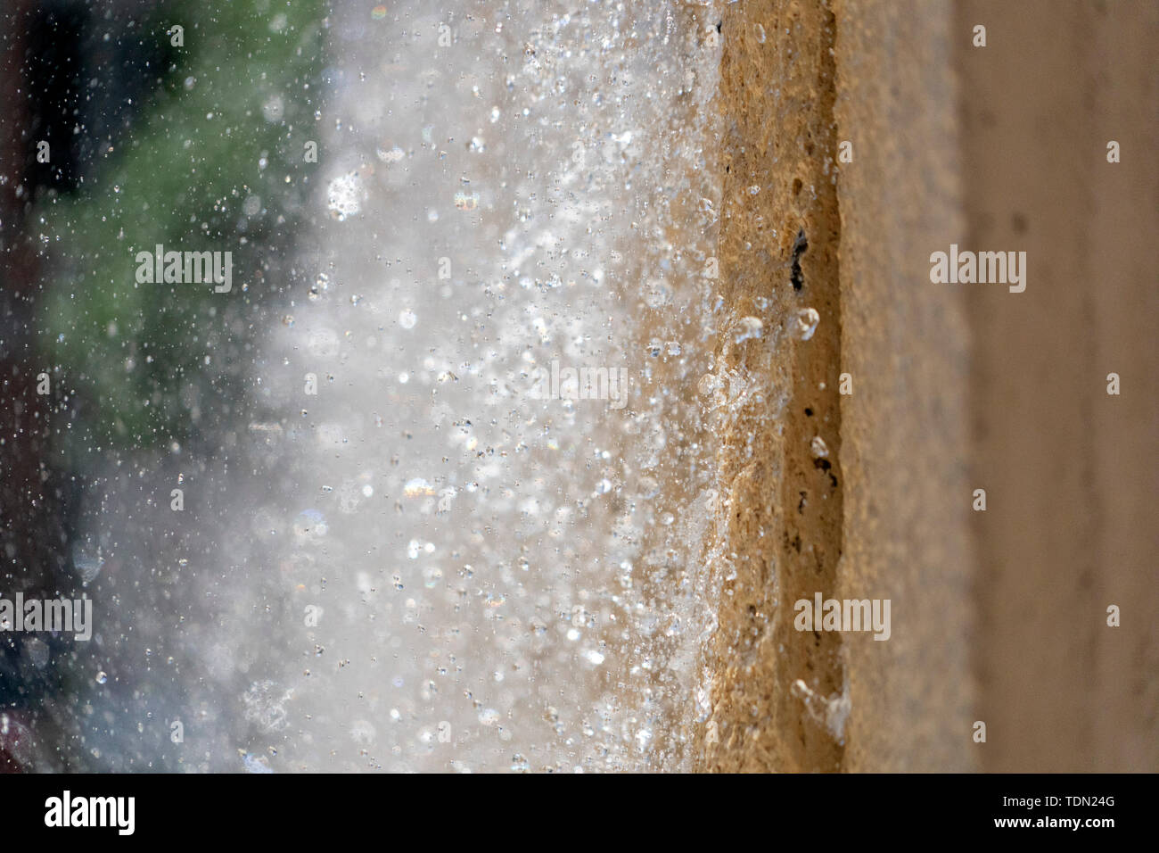 fountain splash on a wall detail close up Stock Photo - Alamy