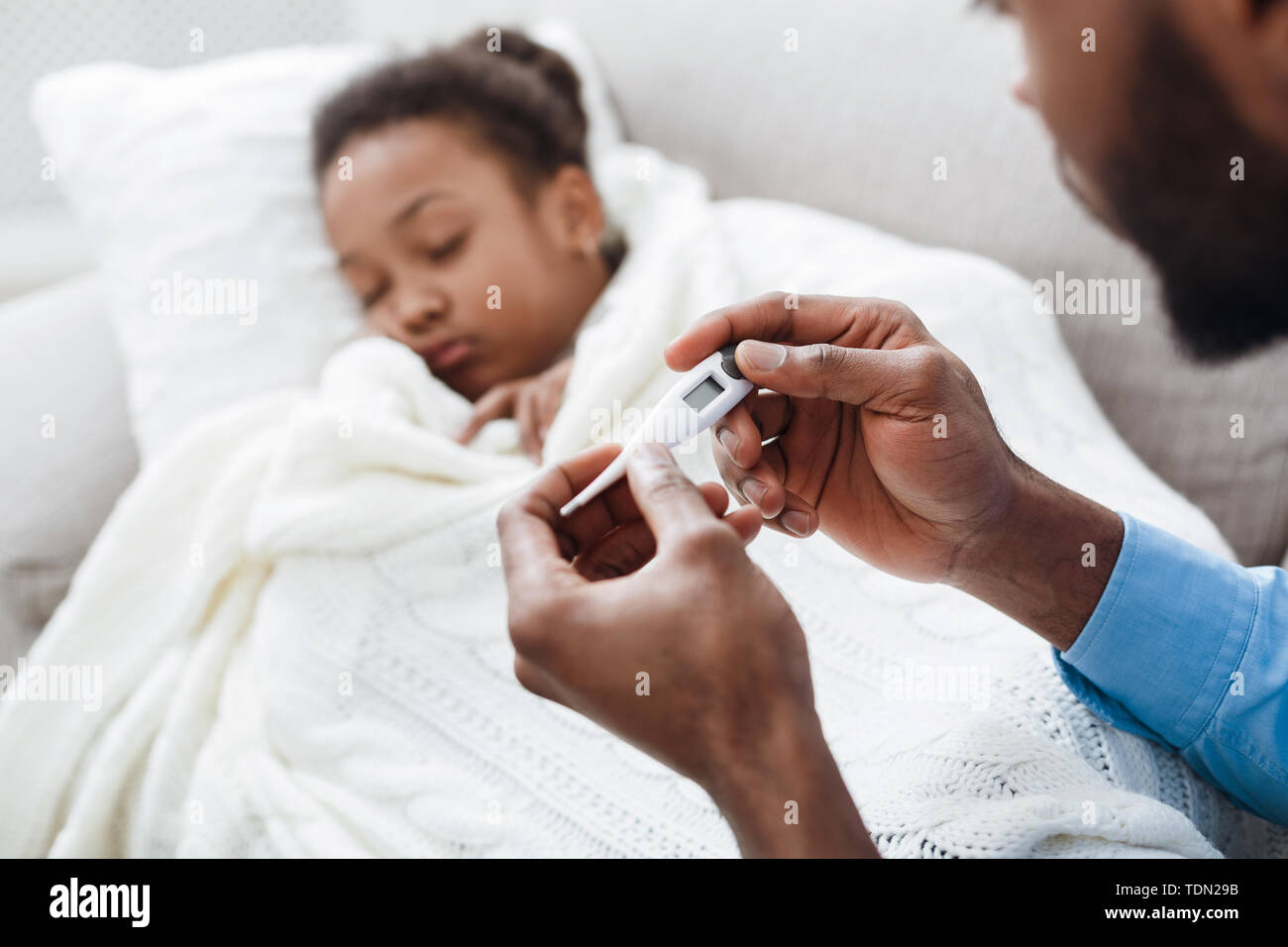 Sick Child. Caring Father Measuring Temperature Of His Daughter Stock ...