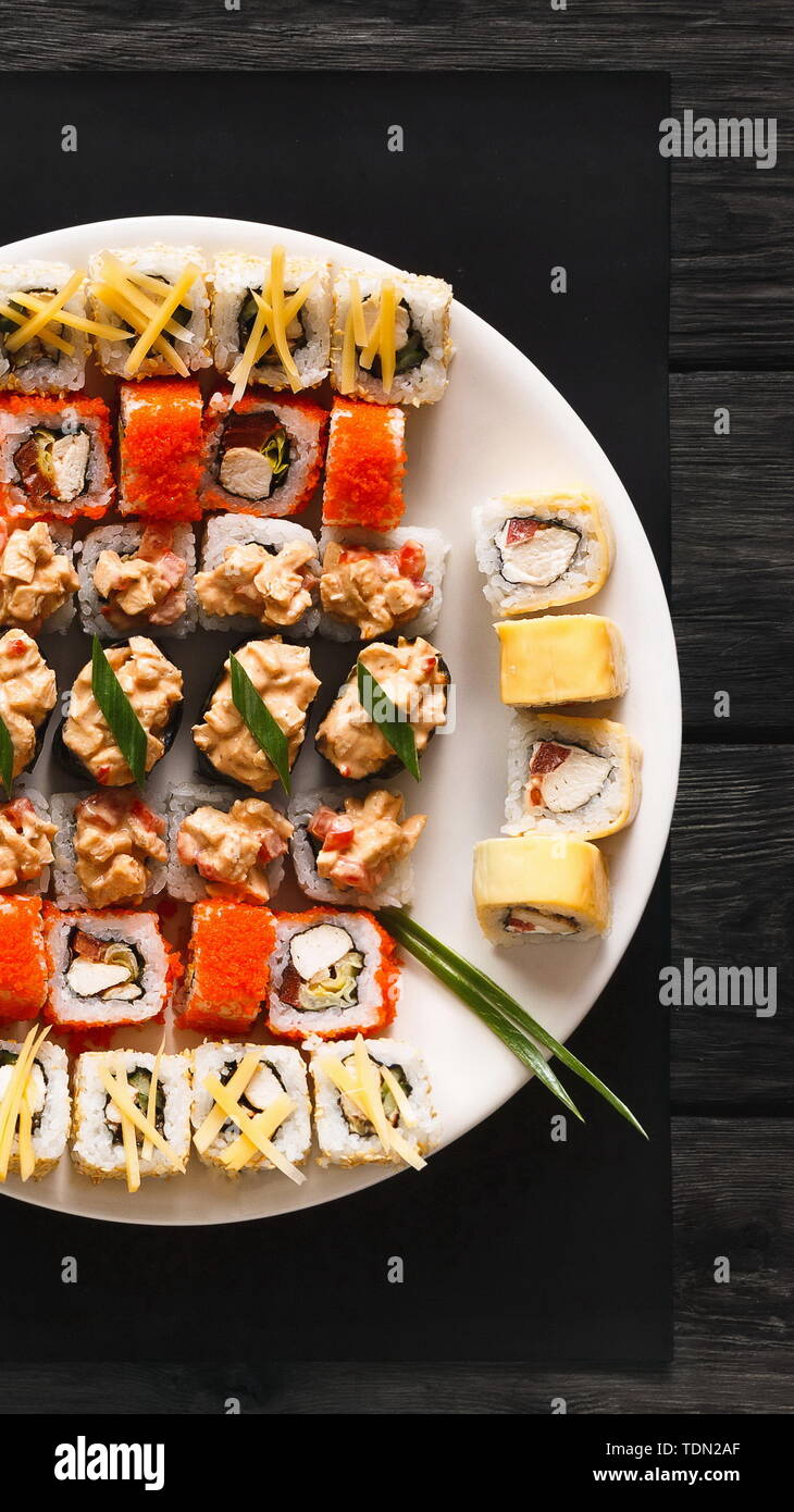 Set of sushi for two with chopsticks on rustic wood background Stock ...