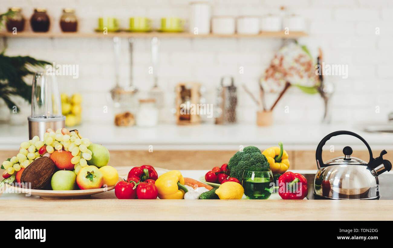 Fresh Fruits And Vegetables On Kitchen Table Stock Photo - Alamy