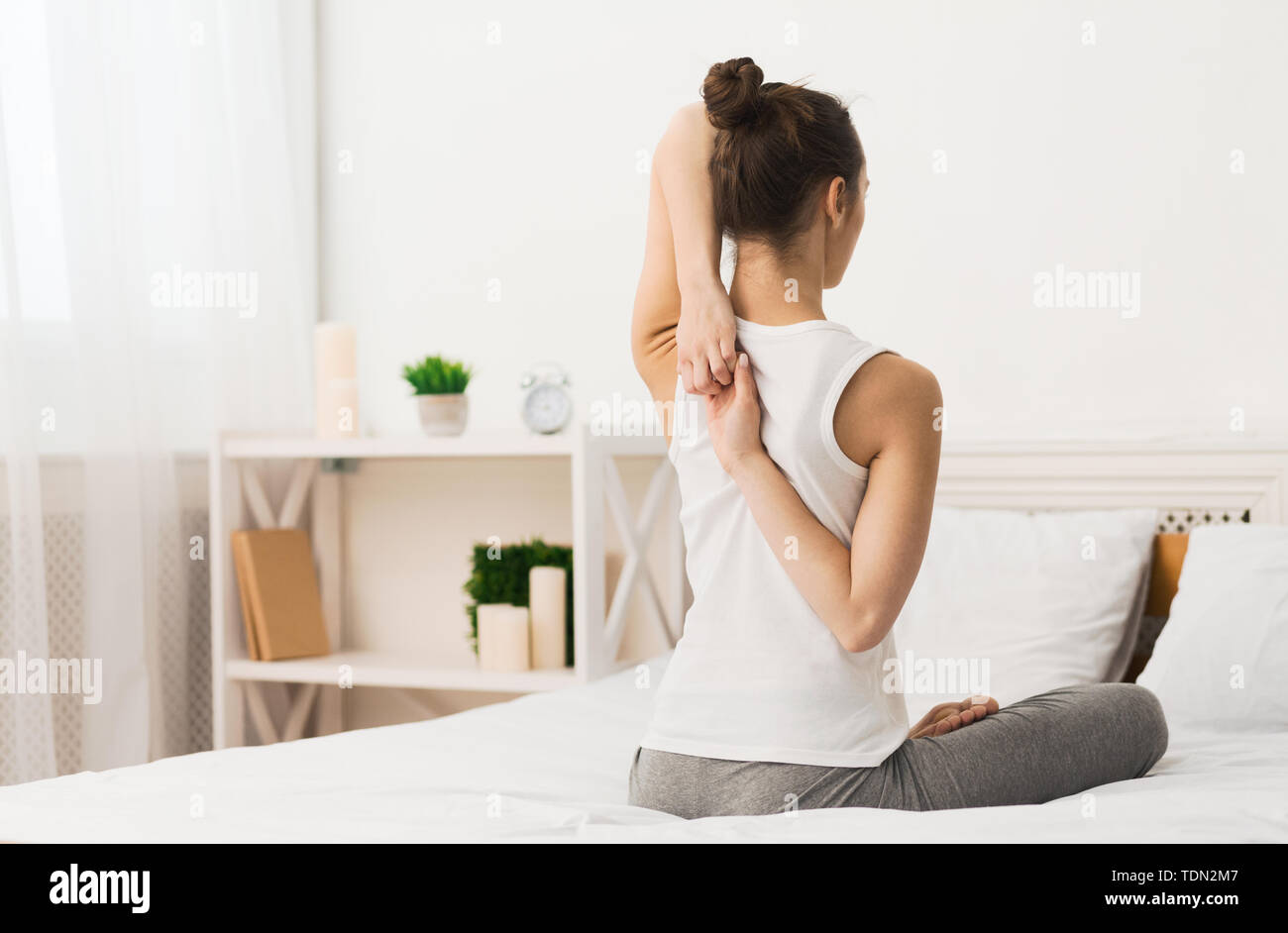 Morning Yoga. Woman Touching Her Hands Behind Her Back Stock Photo - Alamy
