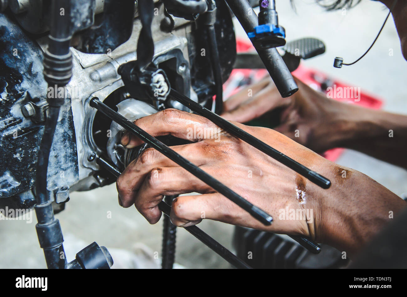 Mechanical repairs engine motorcycle Stock Photo - Alamy