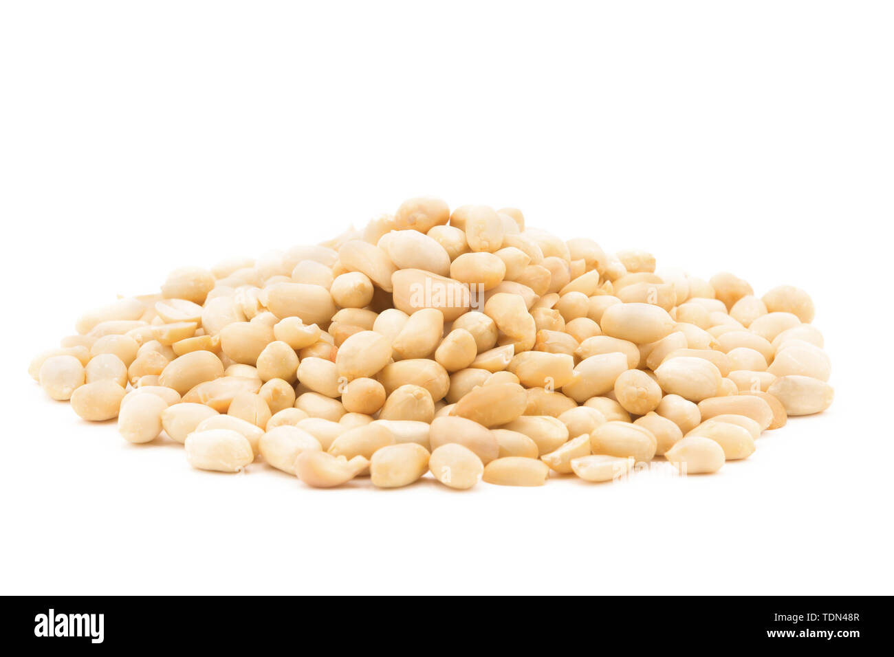 Peeling peanuts on white background Stock Photo - Alamy