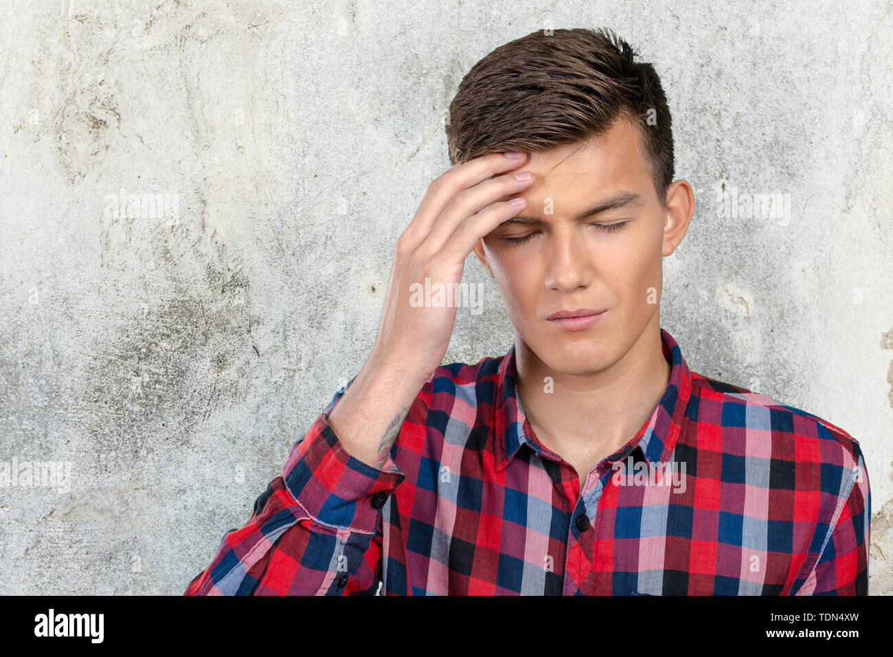 Closeup stressed young man Stock Photo - Alamy