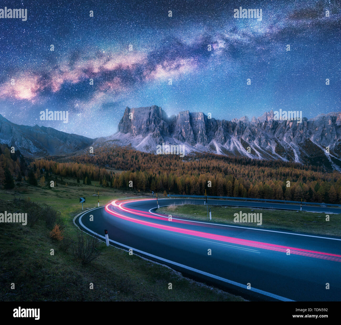 Milky Way over mountain road. Blurred car headlights Stock Photo - Alamy