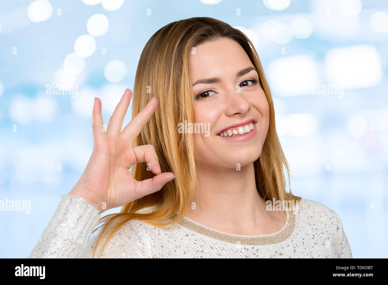 Lovely woman showing ok sign Stock Photo - Alamy