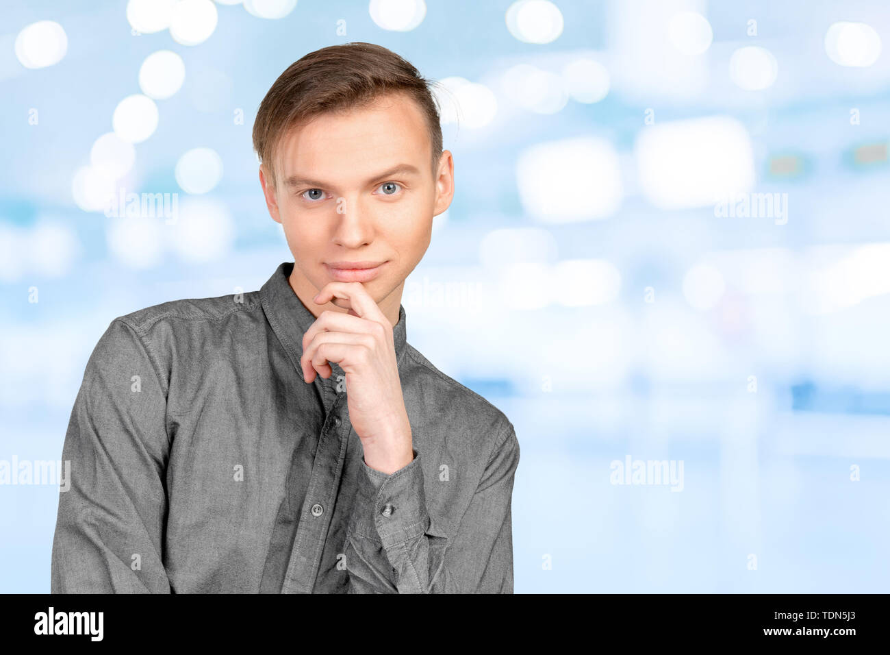 Confused young man thinking Stock Photo - Alamy