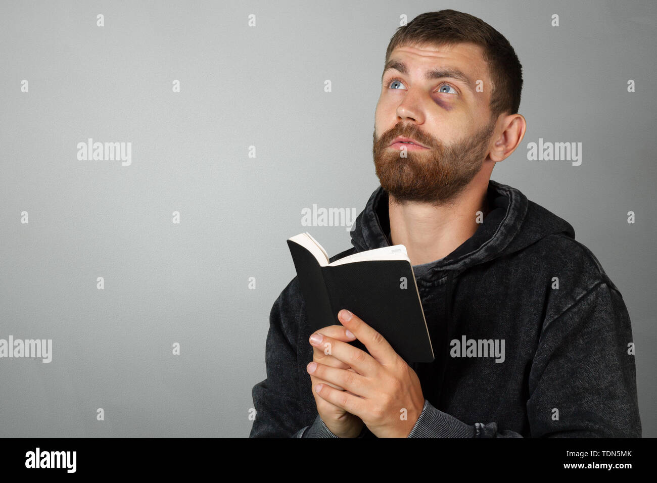Man Holding a Bible isolated Stock Photo - Alamy