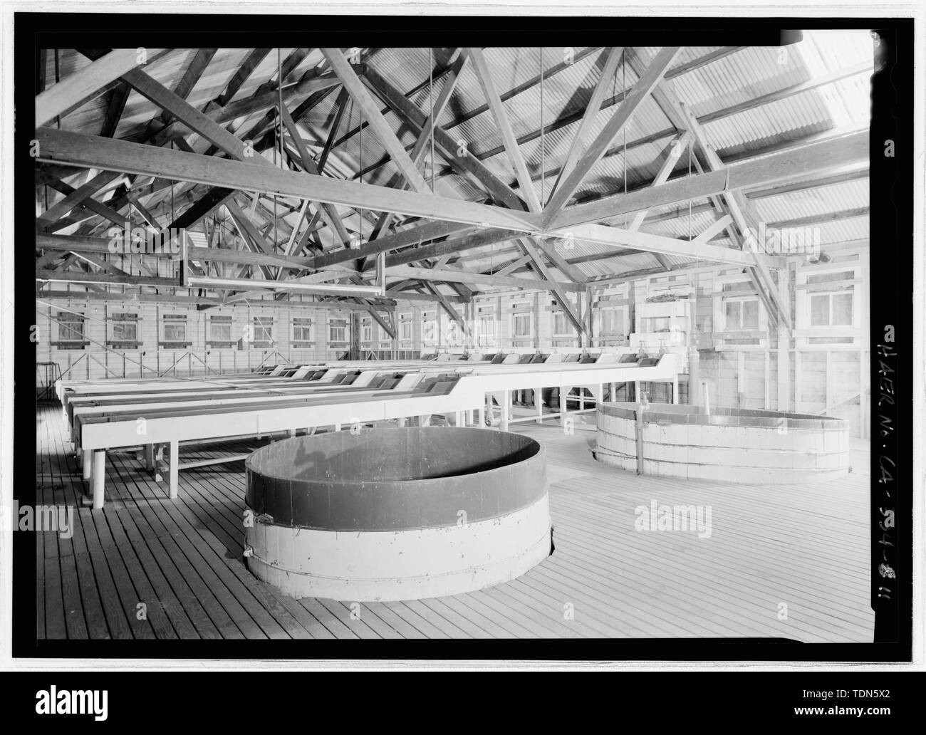Perspective view of interior of the main hatchery building. View to the ...