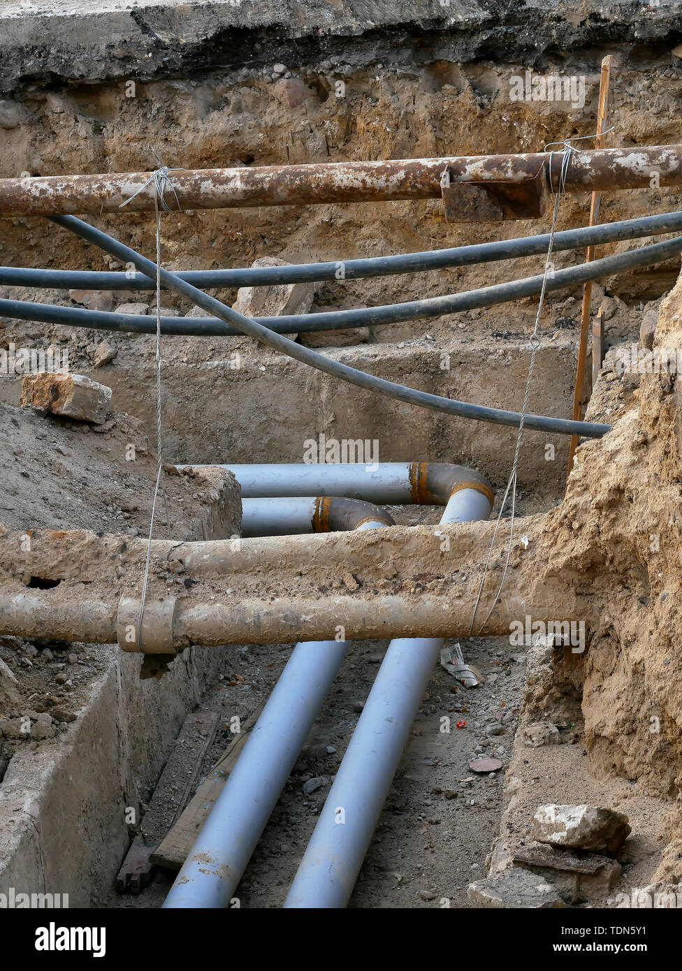 underground utilities, excavated pipes in the ground Stock Photo - Alamy