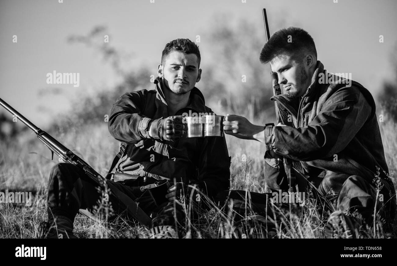 Hunters satisfied with catch drink warming beverage. Rest for real men ...