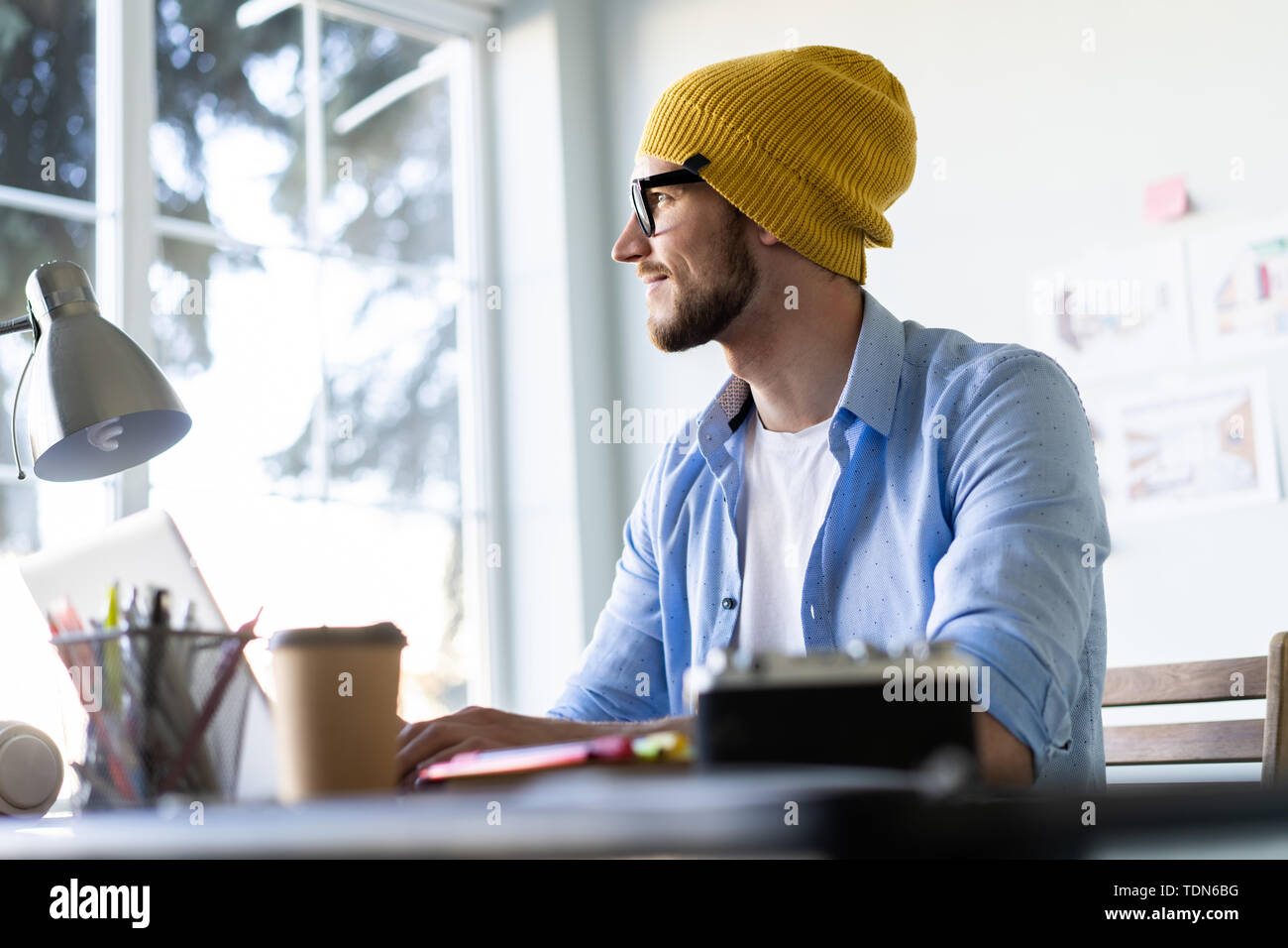 Enjoying his work. Skilled male IT professional freelancer working on ...