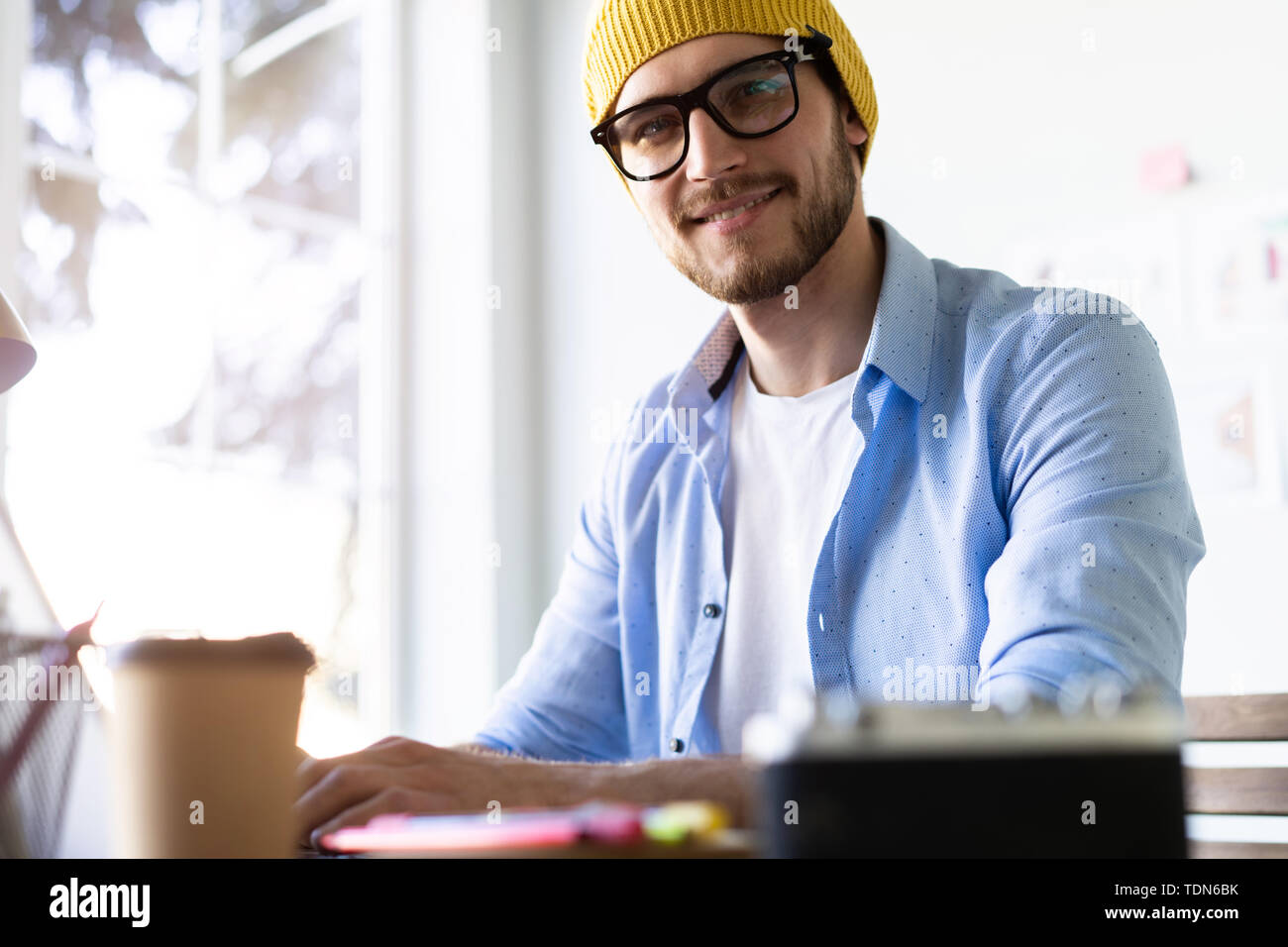 Enjoying his work. Skilled male IT professional freelancer working on ...