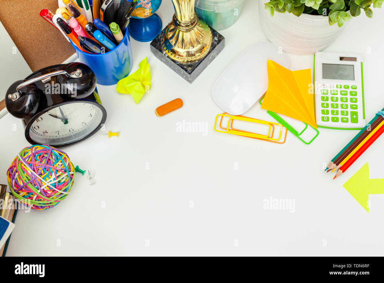 Work place of a creative person with a variety of colorful stationery ...