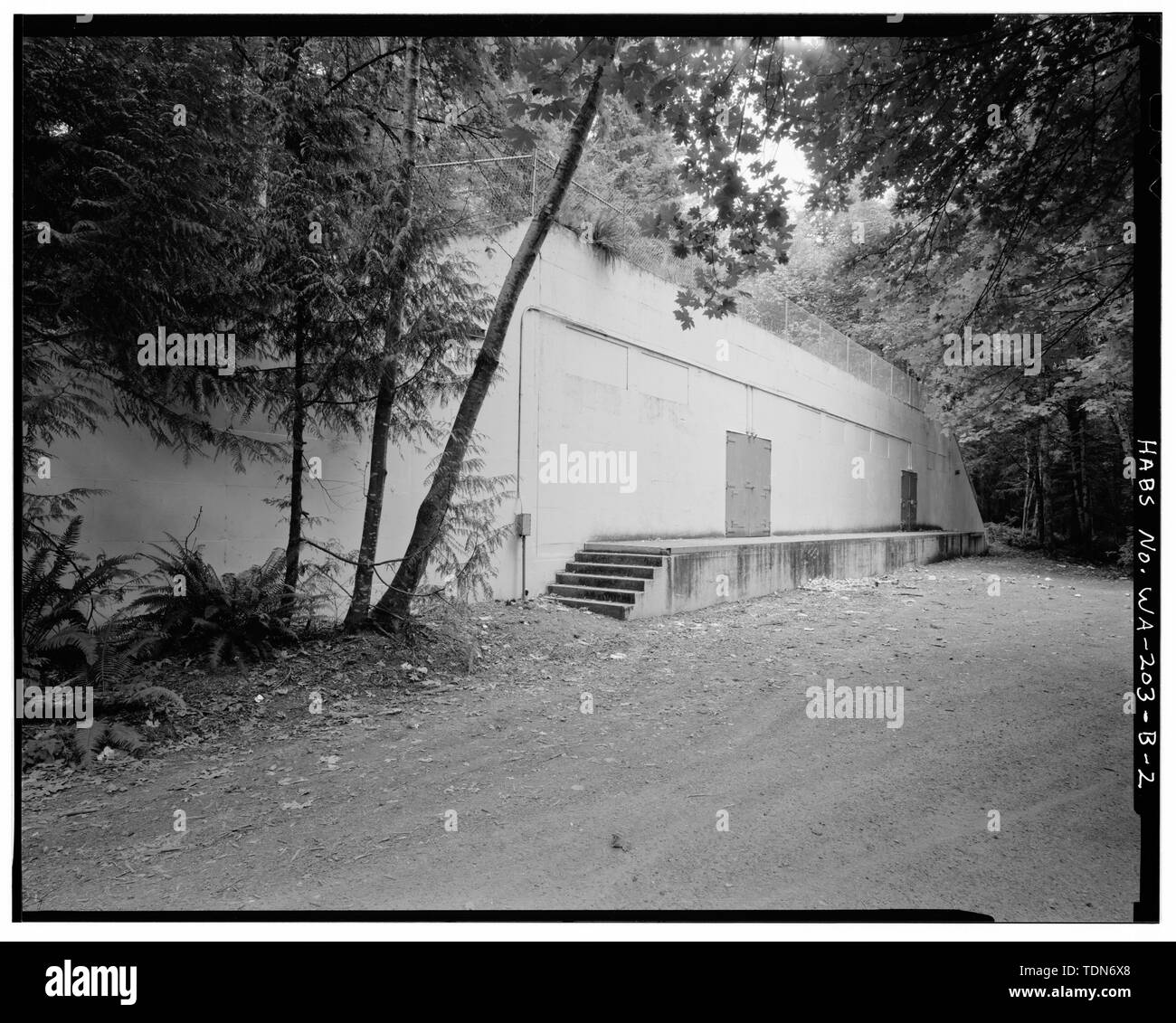Perspective view showing most of east facade including steps and door ...