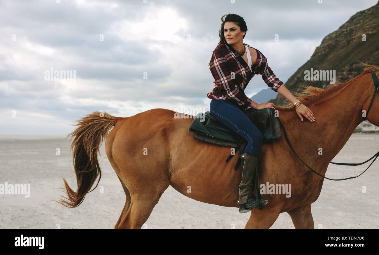 Woman riding a horse on beach hi-res stock photography and images - Alamy