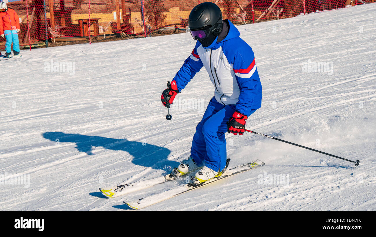 Skiing tourists at the strange slope ski resort in Shenyang City ...