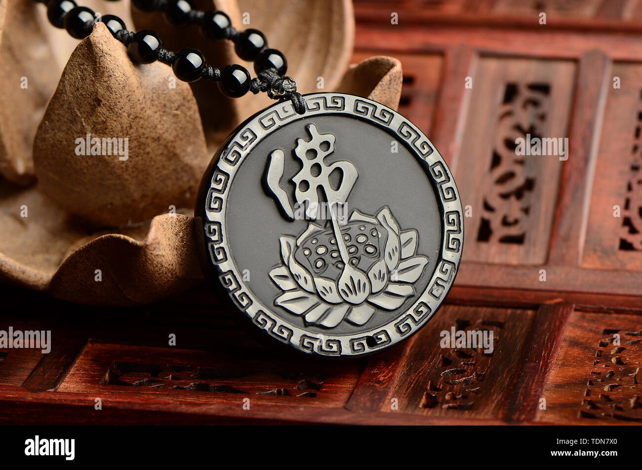 Buddha chain flower obsidian pendant Stock Photo - Alamy