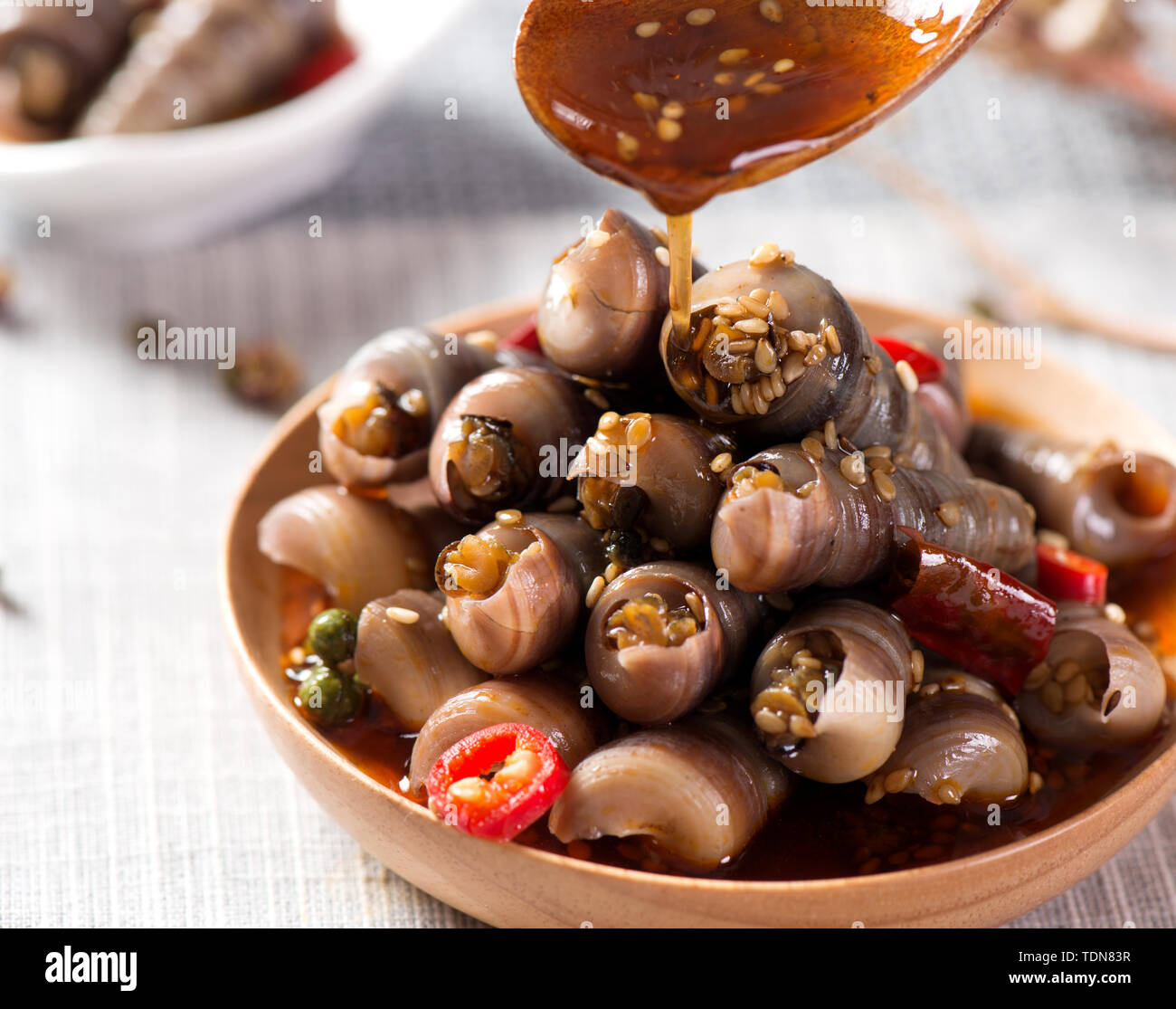 Spicy seafood snail Stock Photo - Alamy