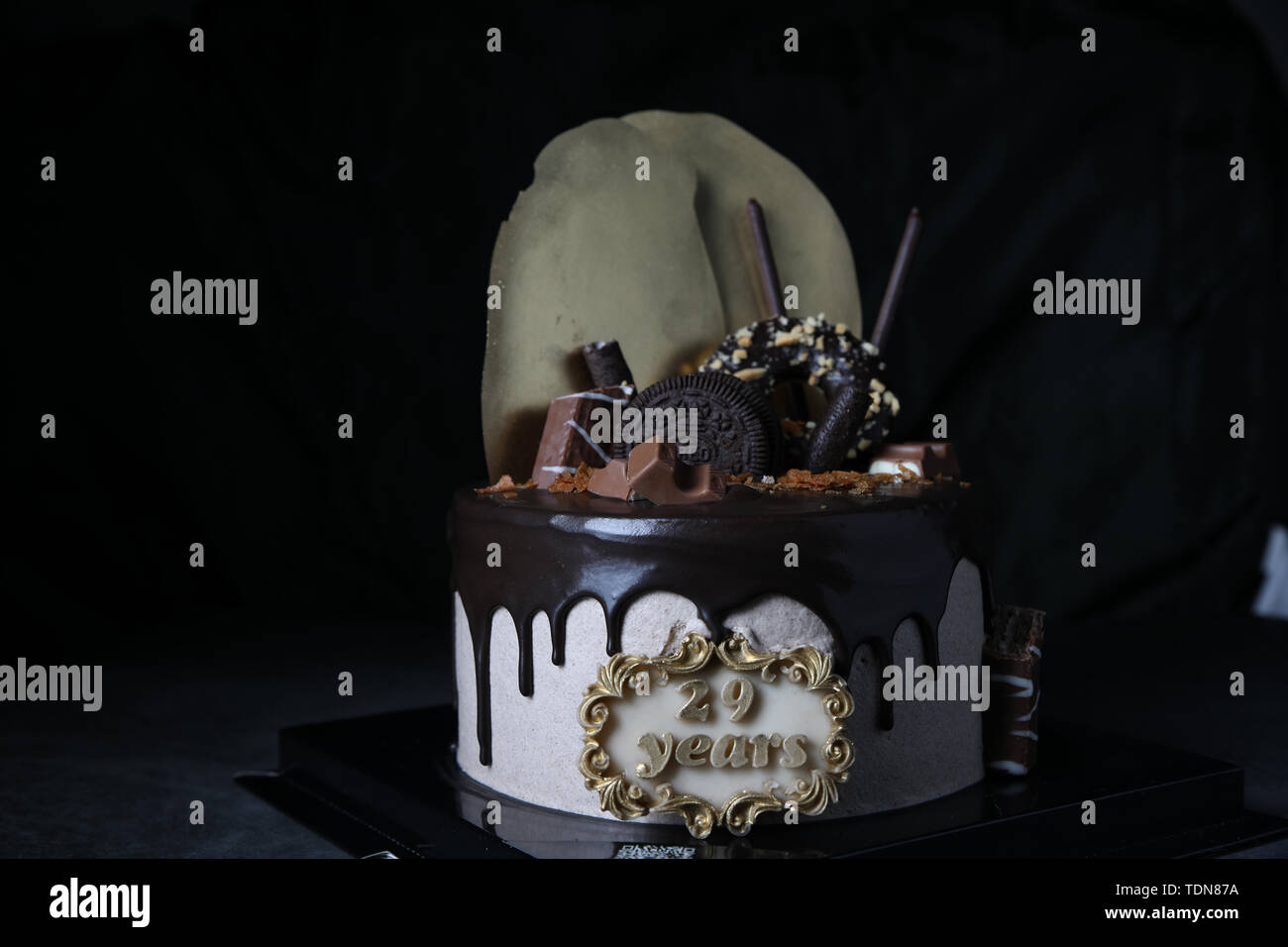 Birthday cake in a dark background Stock Photo - Alamy