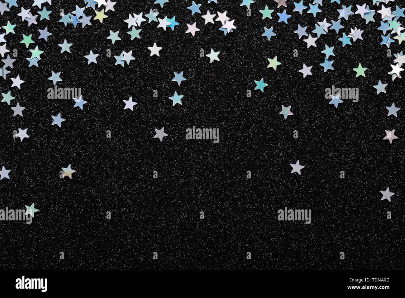 Falling Iridescent Silver Stars Confetti On Black Festive Holiday