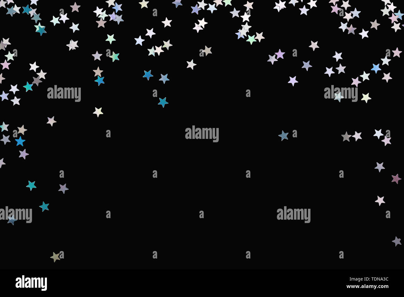 Iridescent Silver Stars Confetti Isolated On Black Festive Holiday