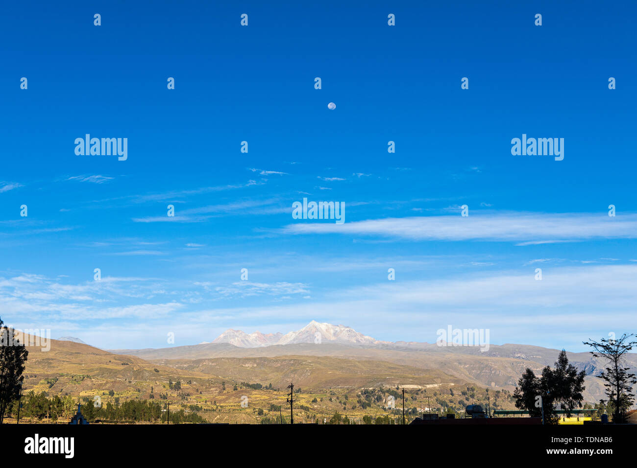 Full moon over the snowcapped Andes in Yanque, Colca canyon, Peru ...