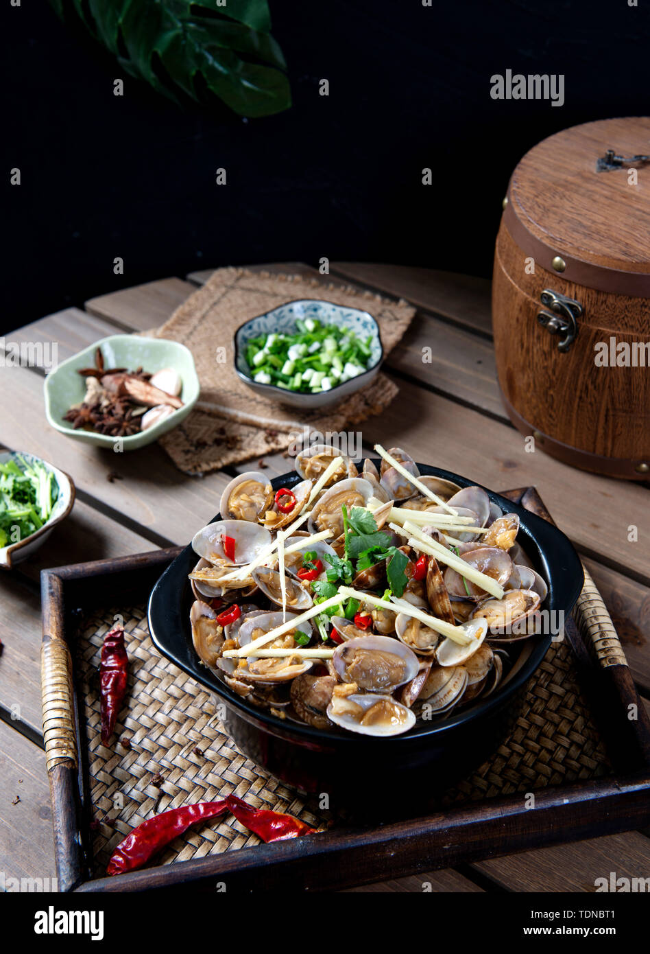Golden soup, spicy flower armor, pink noodles Stock Photo - Alamy