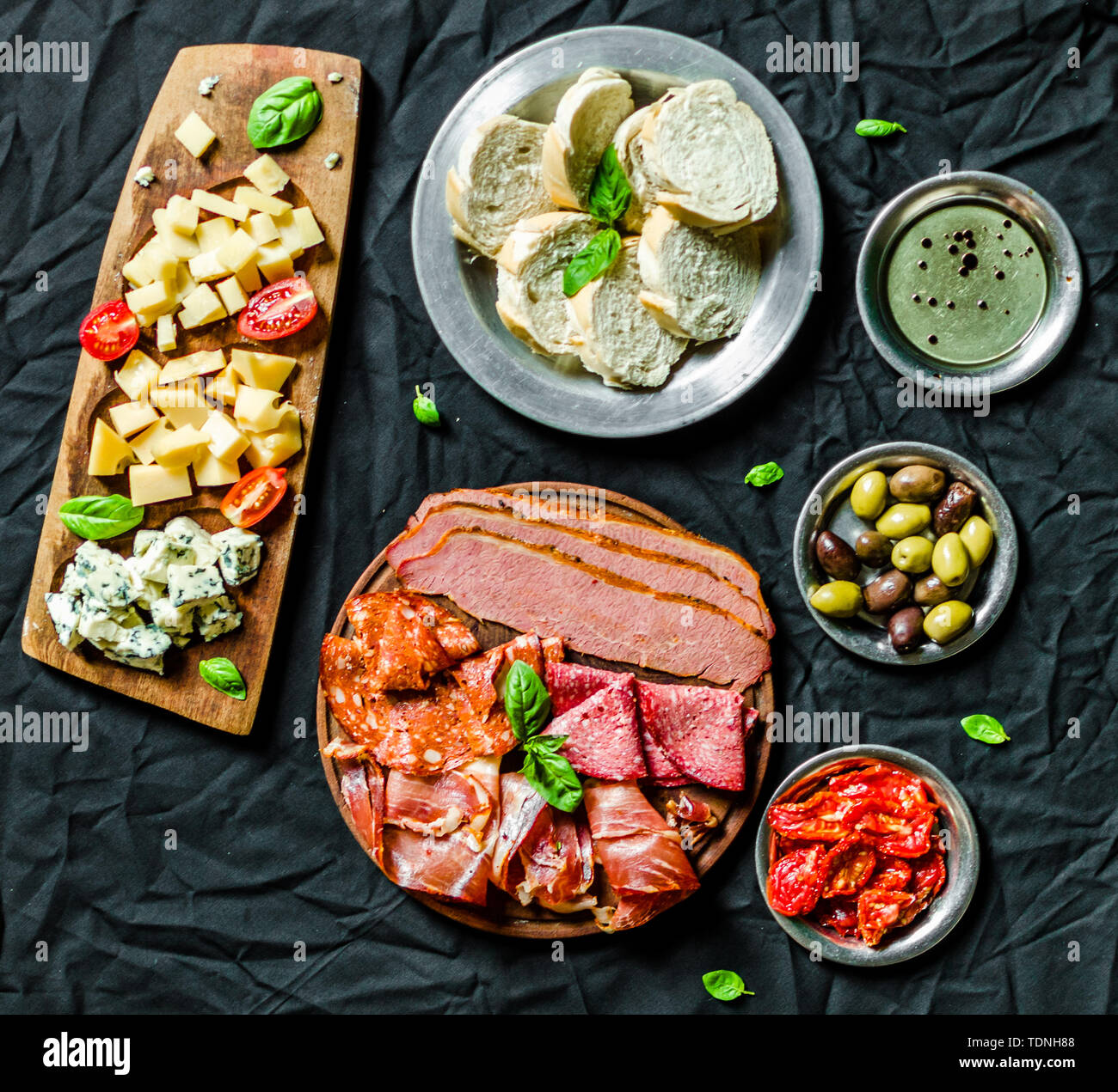 Italian cold meat and cheese antipasti delicatessen platter on black ...
