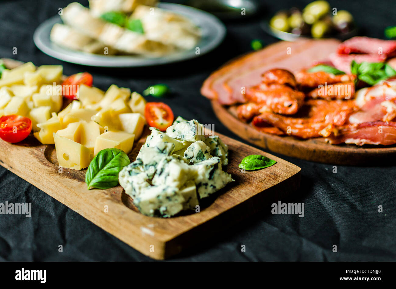 Italian cold meat and cheese antipasti delicatessen platter on black ...