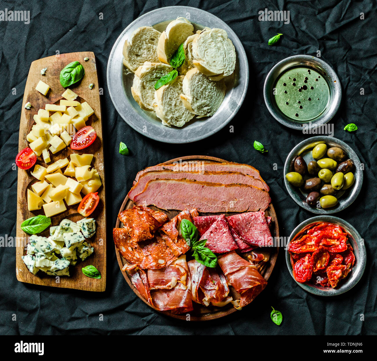 Italian cold meat and cheese antipasti delicatessen platter on black ...