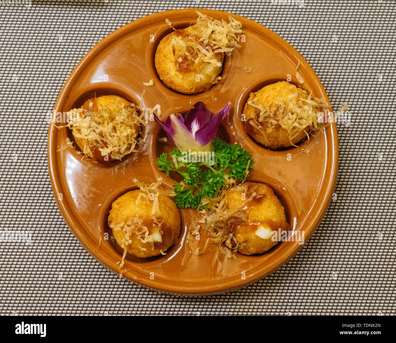 Japanese cuisine: octopus meatballs Stock Photo - Alamy