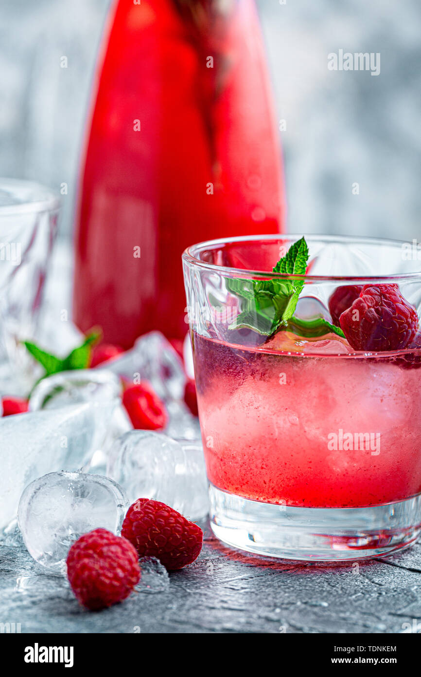 Raspberry Cocktail Fizz Lemonade Ice Tea With Fresh Mint On Blue Wooden Background Close Up