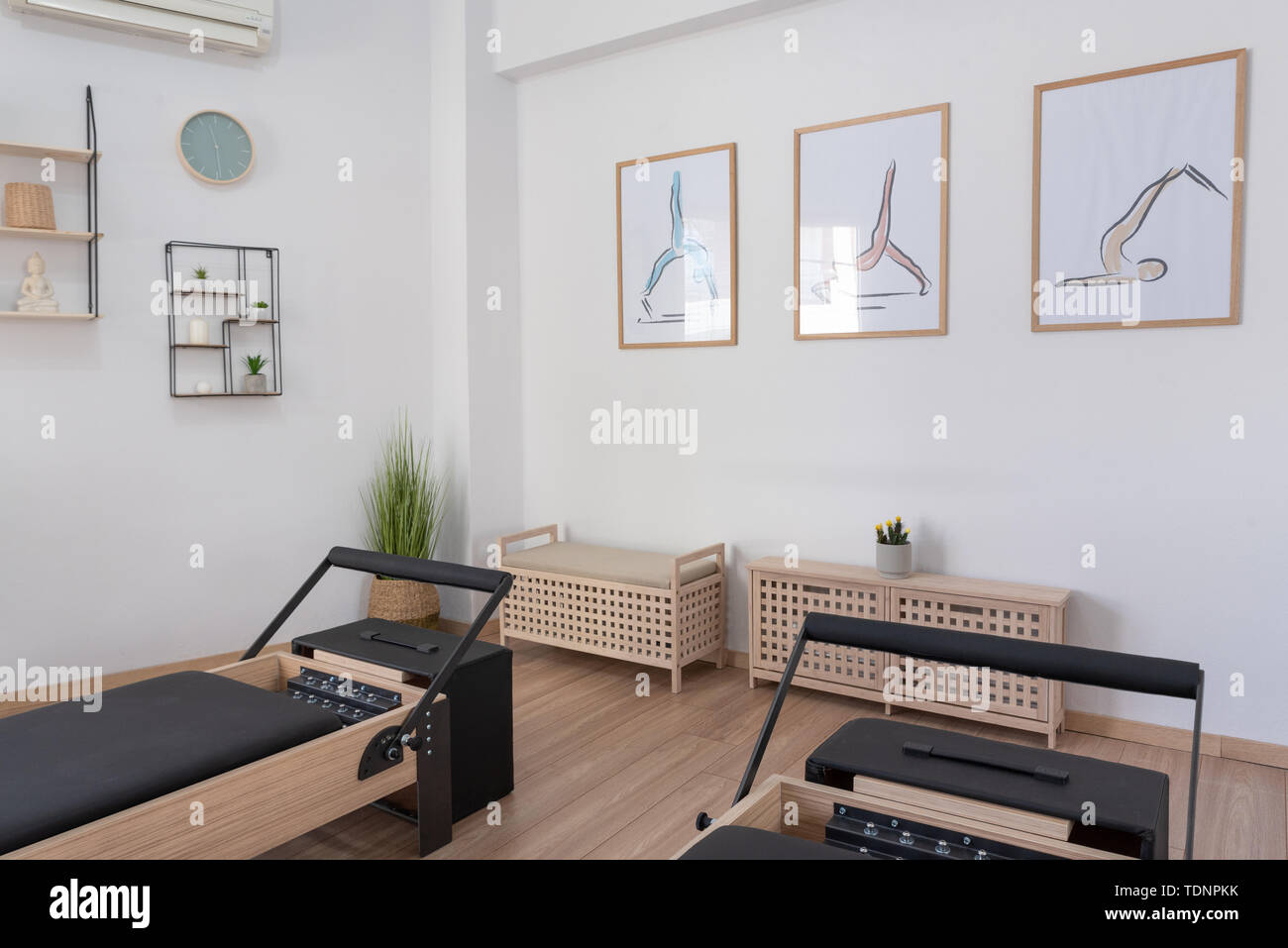 Pilates studio room with reformer beds Stock Photo - Alamy