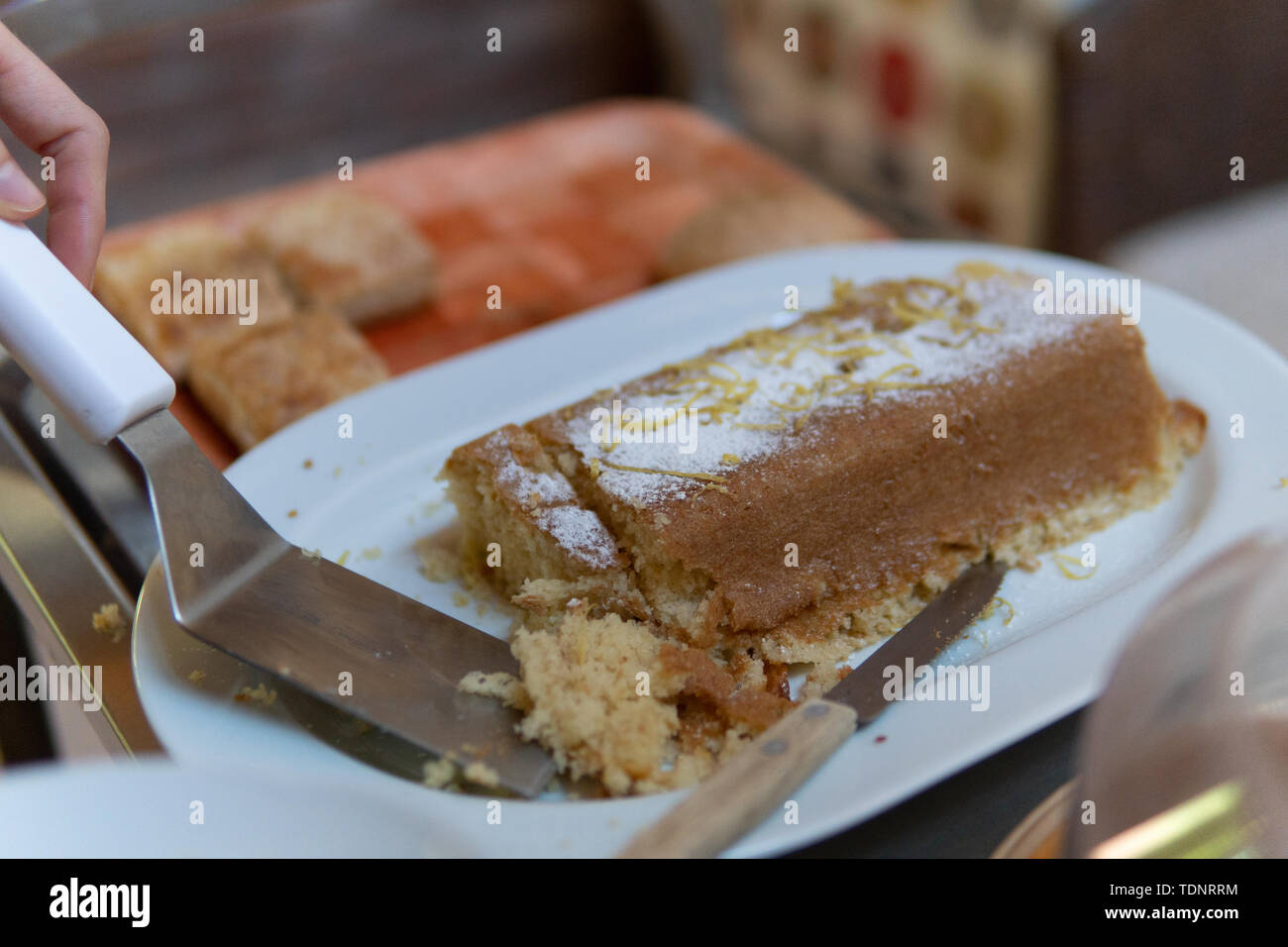 Cutting into breakfast danish pastry dessert Stock Photo - Alamy