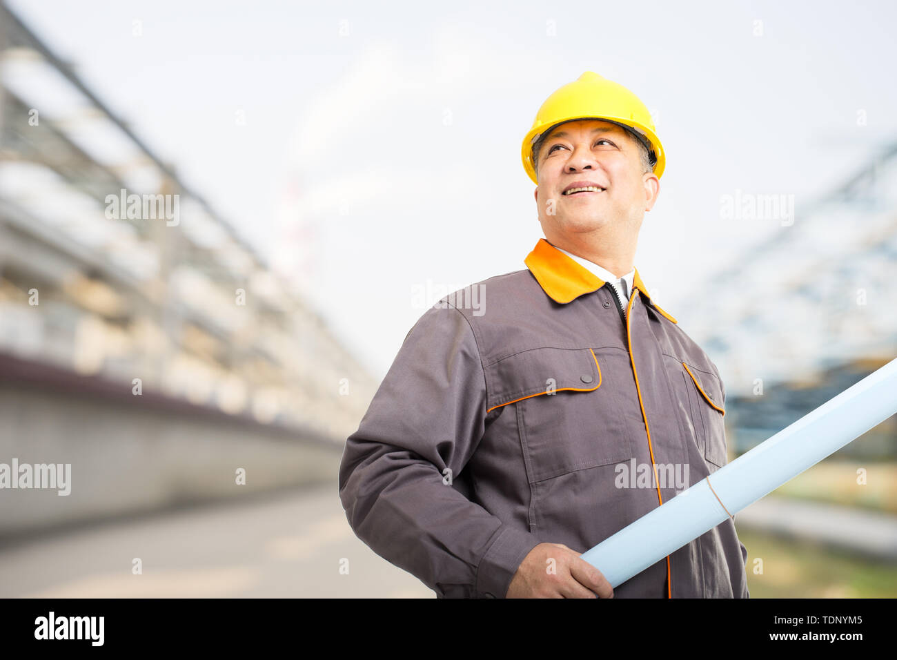 old chinese man engineer in oil refinery plant Stock Photo - Alamy