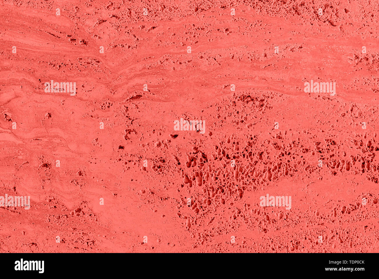 Closeup of trendy coral colored porous stone textured wall. Abstract ...