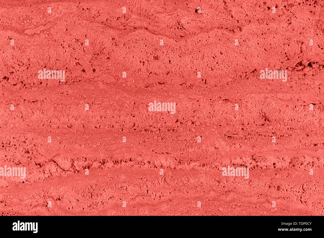 Closeup of trendy coral colored porous stone textured wall. Abstract ...