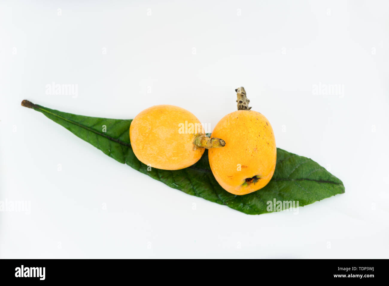 Loquat background picture Stock Photo - Alamy