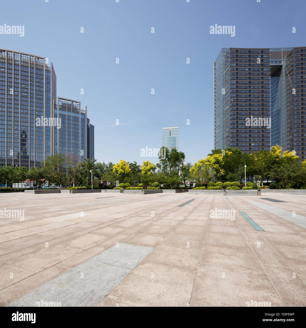 Empty square and modern office building Stock Photo - Alamy
