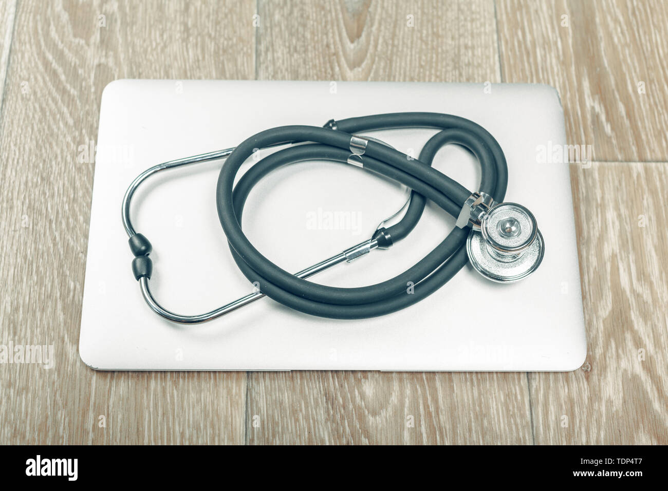 Stethoscope on laptop, close-up Stock Photo - Alamy