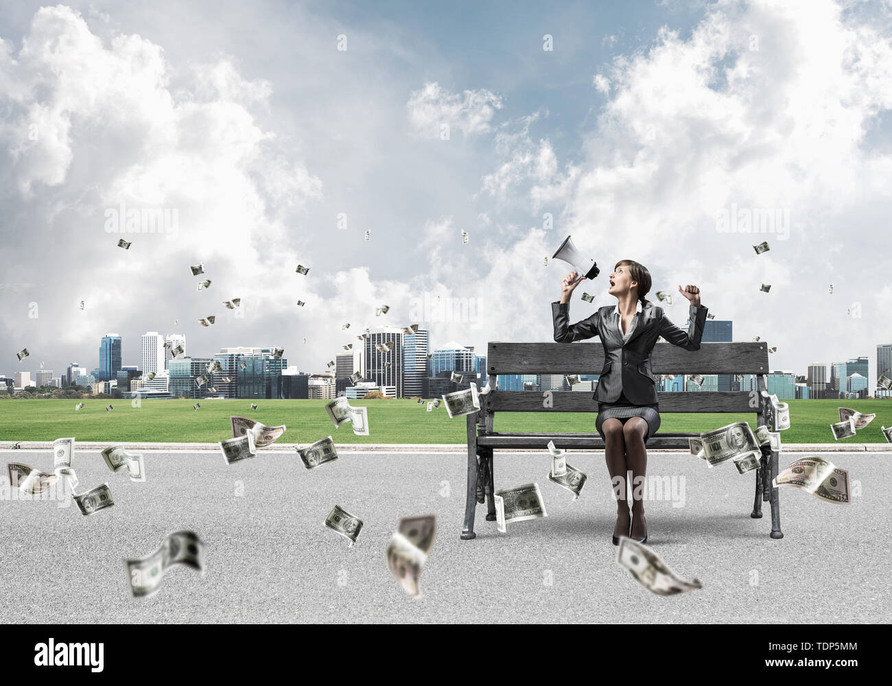 Young woman with megaphone sitting on wooden bench. Money income ...