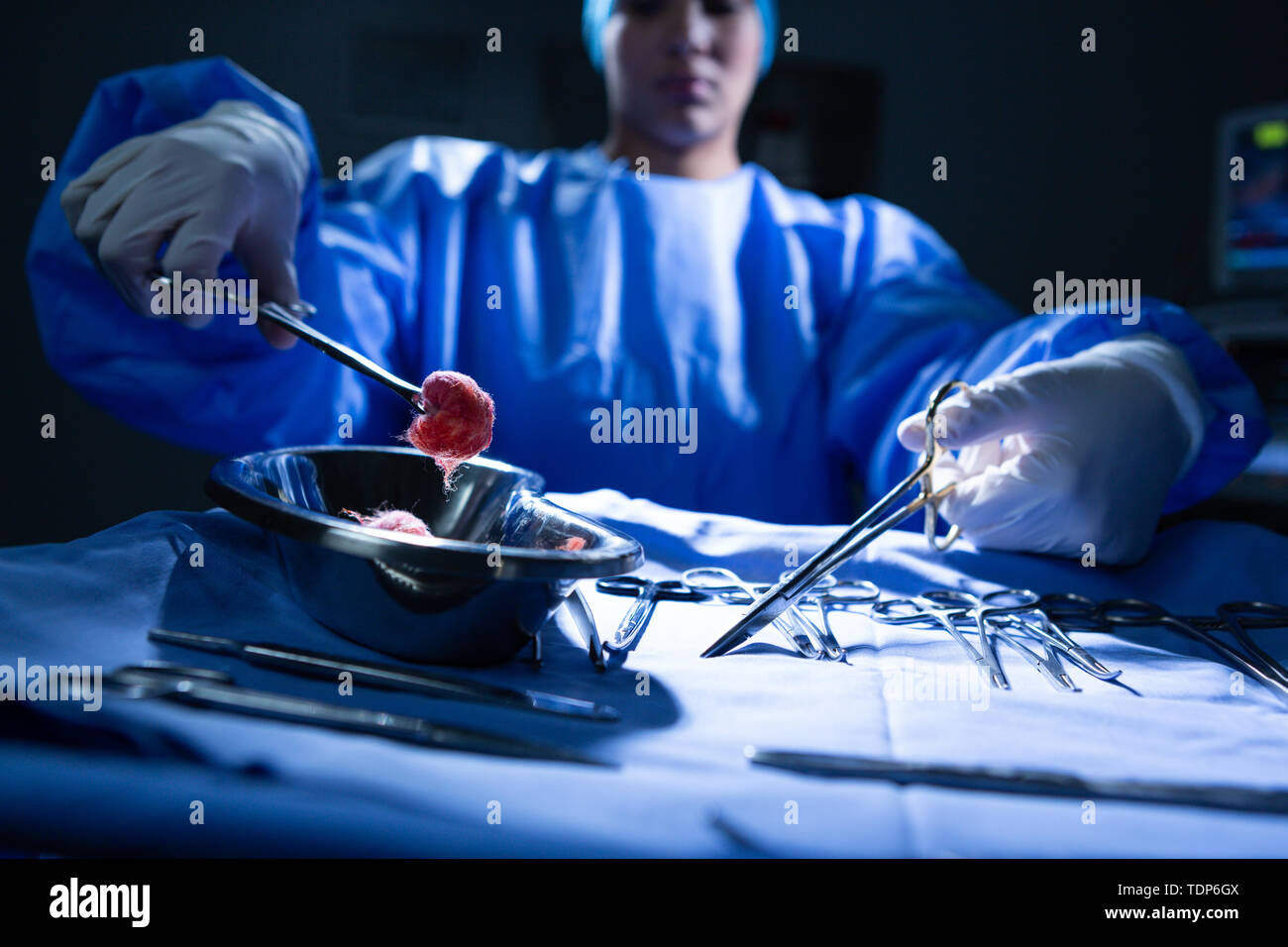Surgeon in operation with instruments hi-res stock photography and ...