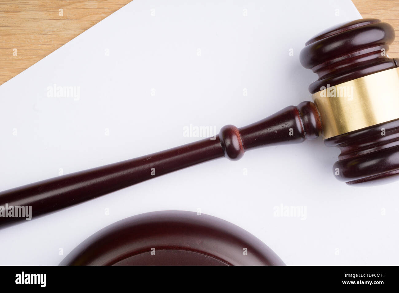 Judge hammer on white paper and table Stock Photo - Alamy