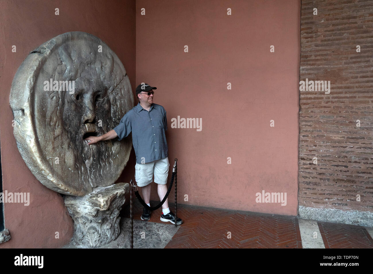 ROME, ITALY - JUNE 15 2019 - Tourist testing the mouth of truth mask ...