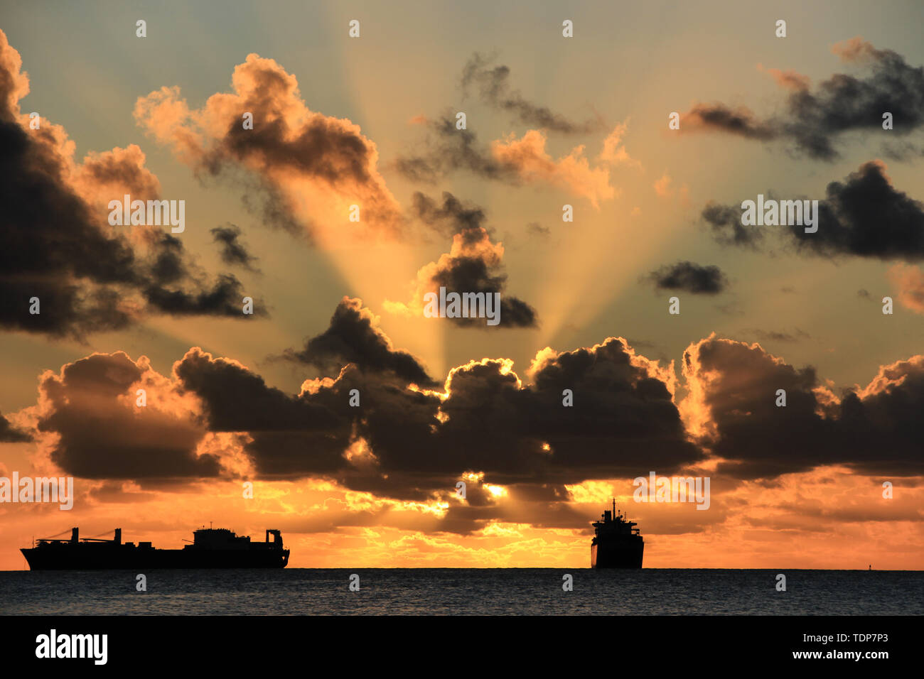 Seaside sunset with ships Stock Photo - Alamy